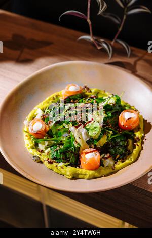 Tasty salad with salmon, guacamole and fresh vegetables Stock Photo - Alamy