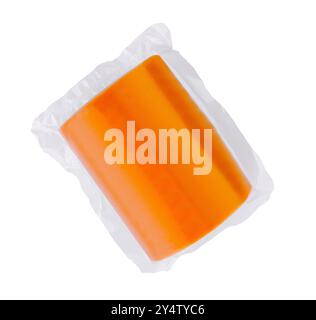 Block of cheddar cheese wrapped in plastic staying fresh and ready to ...