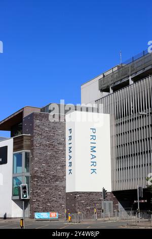 Primark logo next to Multi storey car park with yellow and white car ...