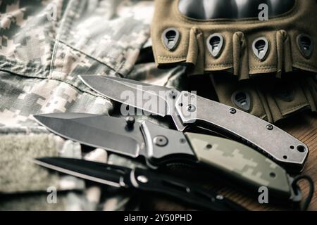 Tactical objects, military equipments. selective focus on folding knife ...