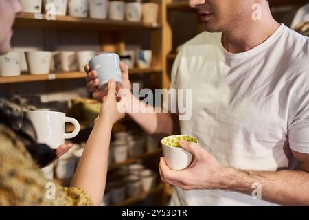 A couple joyfully creates unique pottery pieces side by side Stock ...