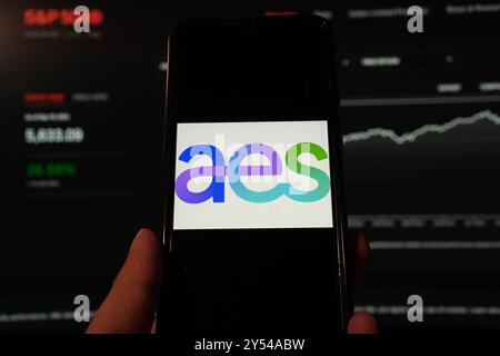 In this photo illustration, the AES Corporation logo is displayed on a ...