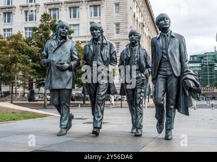 This image is the statue of the Liverpool music group the Beatles who ...