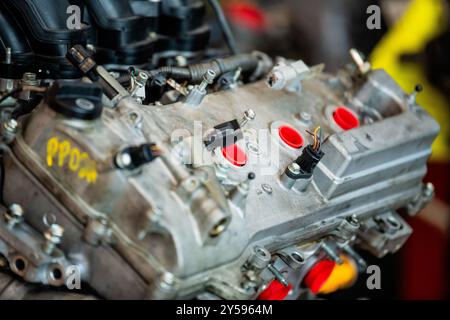 A deconstructed car engine at a mechanic's garage Stock Photo - Alamy