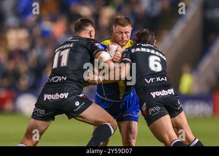 Luke Thomas of Warrington Wolves is tackled during the Betfred Super ...
