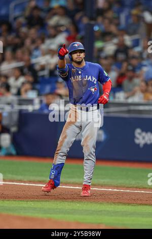 Toronto Blue Jays' Jonatan Clase (8) runs after hitting a single during ...