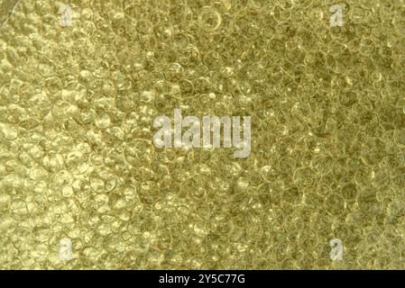 Oil drops in a glass of water Stock Photo - Alamy