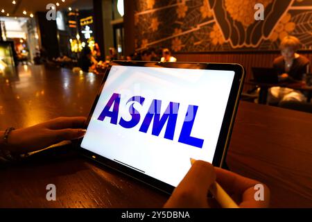 In this photo illustration, the ASML logo is displayed on the screen of ...