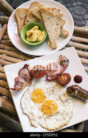 Classical english breakfast with fried bacon, mushrooms and eggs ...