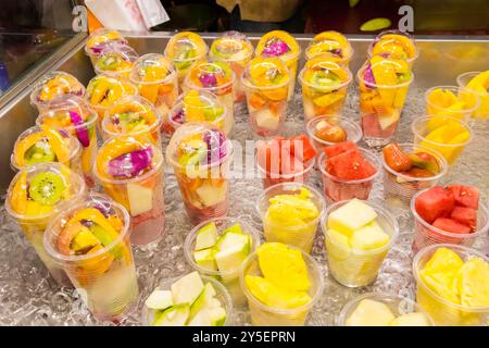 Colorful fruit cups at a street market in summer Stock Photo - Alamy