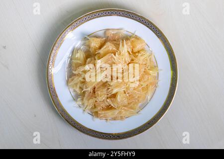 Top view of fresh peeled pomelo on bright wooden table background for ...