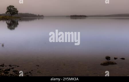 Lochindorb castle on a very misty and still early morning Stock Photo ...