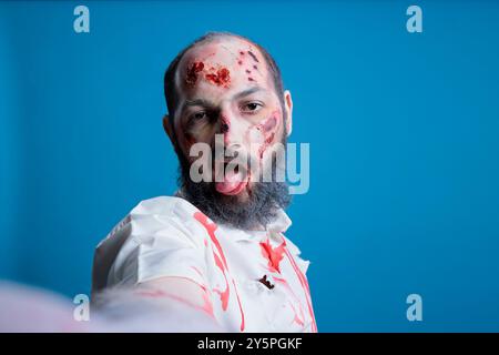 POV of creepy haunting flesh eating zombie taking selfies. Portrait of ...