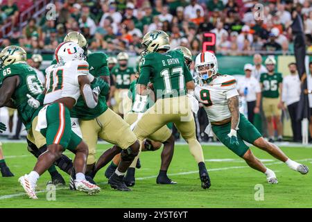 Miami defensive lineman Tyler Baron (9) smiles after an NCAA football ...