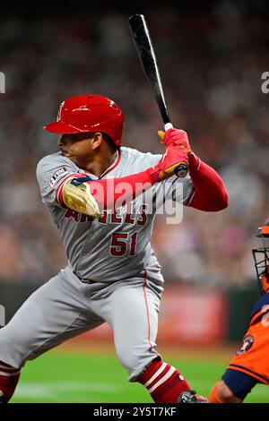 Los Angeles Angels' Gustavo Campero, right, is hit by a pitch as ...