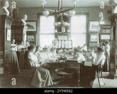 Young women in a vintage library Stock Photo - Alamy