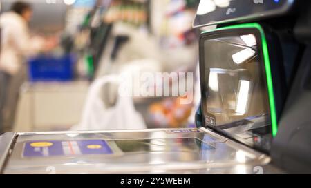Customer scans food products at selfservice kiosk in store Stock Photo ...