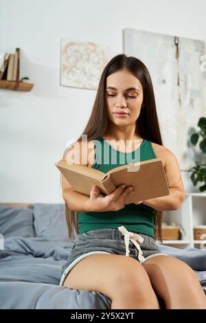 A young brunette woman with short stature listens to music in her cozy ...