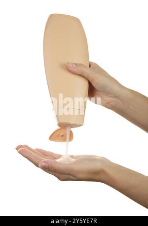 Woman pouring personal hygiene product on hand against light blue ...