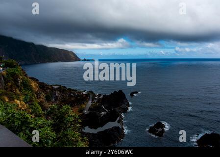 Natural pools of ocean water with sheer cliffs at Seixal Madeira ...