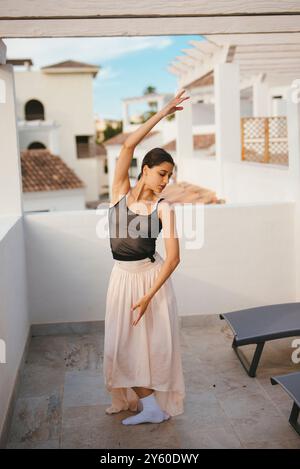 An Elegant Dance Pose Captured on a Stunning Modern Balcony with ...