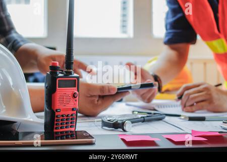 A team of architects and engineers discuss with investors to design ...