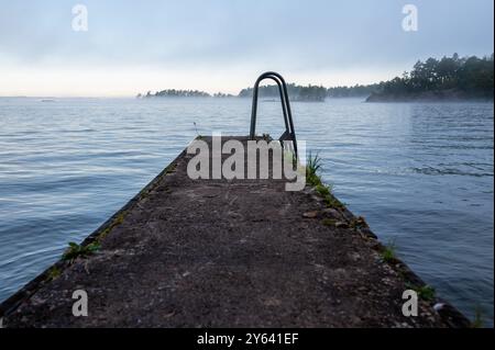 Bathing jetty made of concrete and metal ladder Stock Photo - Alamy