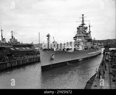 Edging slowly into dry dock at Devonport is the 35,000 ton King George ...