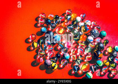 Colorful marbles with scattered swirl marbles on dark background Stock ...