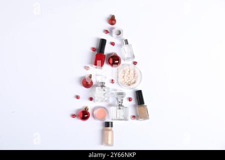 Christmas tree shape made of perfume bottles and cosmetic products on ...