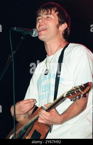 Lead singer of Blur, Damon Albarn with a joint behind his ear during a ...
