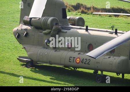 Soldier checking the rear rotor of a twin-rotor military transport ...