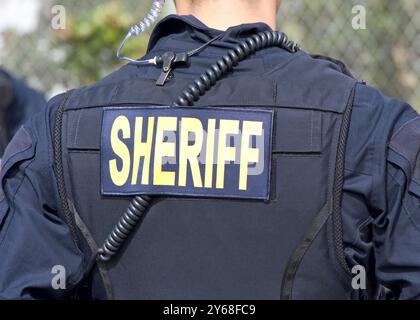 Close up on Sheriff title logo on back of flack jacket Stock Photo - Alamy