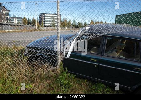 car crashed through chain-link fence Stock Photo - Alamy