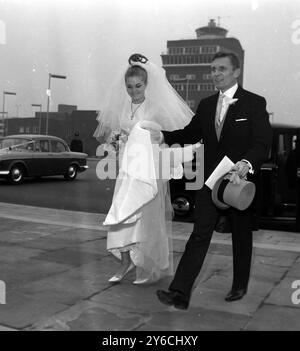 WEDDING OF ALAN DOBIE & ACTRESS MAUREEN SCOTT TOAST EACH OTHER IN LONDON ; 2 DECEMBER 1963 Stock ...