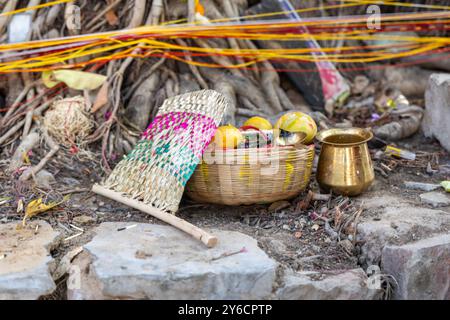 worships of holy banyan tree with offerings and bamboo hand fan at day ...