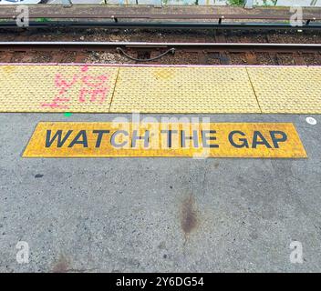 Train platform warning to watch the gap between the subway train and ...
