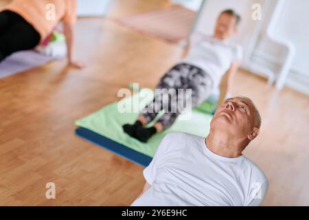 Senior Man Performing Neck and Back Exercises to Promote Healthy Aging ...