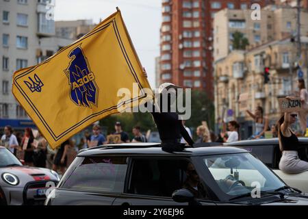 Ukrainian girl rides in a car with banner Free Azov. Kyiv - 8 September ...