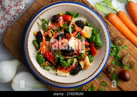 Healthy red berry and brie salad. Top view table with decorations Stock ...