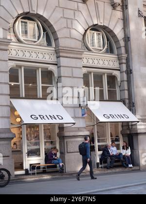 City workers sitting outside Grind Coffee shop Royal Exchange ...
