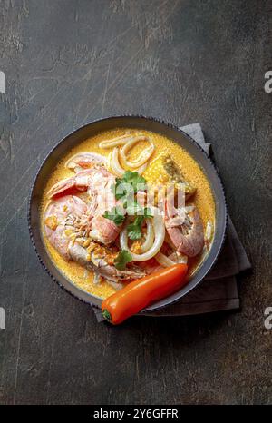 Food, Peruvian seafood soup Chupe de Camarones in gray bowl, top view ...
