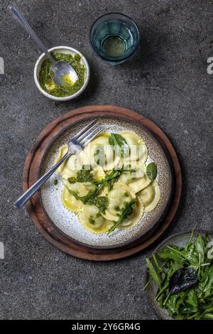 Italian spinach ricotta ravioli, Top view, black background, copy space ...