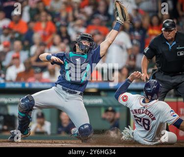 Seattle Mariners catcher Cal Raleigh looks on during a spring training ...