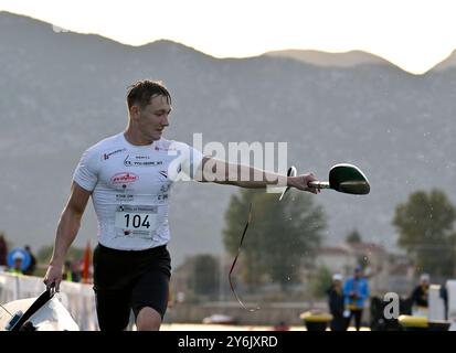 Philip Knudsen (DEN) removes some seaweed as he goes through the ...