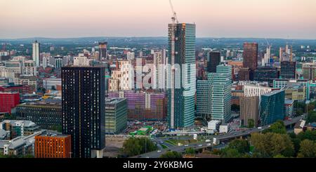 Aerial image of Manchester skyline touched by the golden color of the ...
