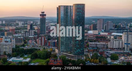 Aerial image of Manchester skyline touched by the golden color of the ...