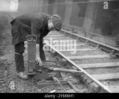 At King's Cross. Fog signalling device at King's Cross. Placing ...