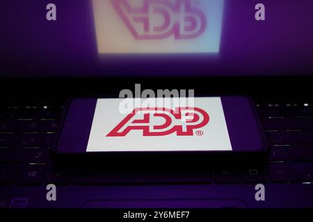 In this photo illustration, the Automatic Data Processing (ADP) logo is ...