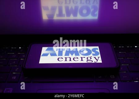 In this photo illustration, the Atmos Energy Corporation logo is ...